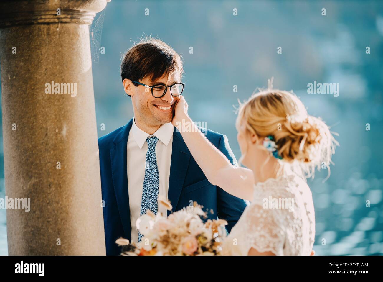 Woman touching man cheek hi-res stock photography and images - Alamy