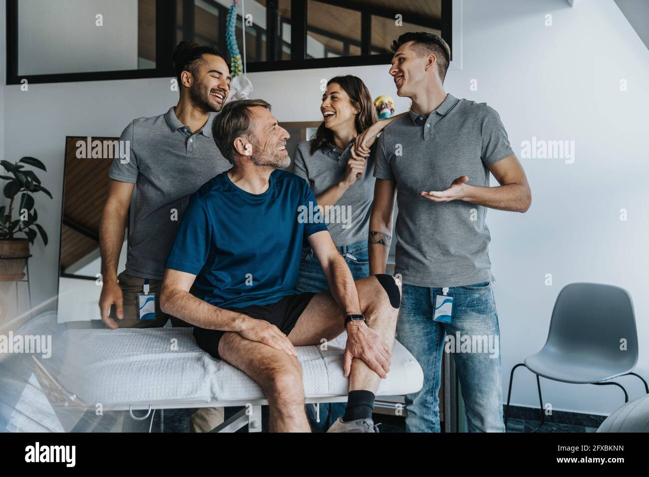 Man standing behind table hi-res stock photography and images - Alamy