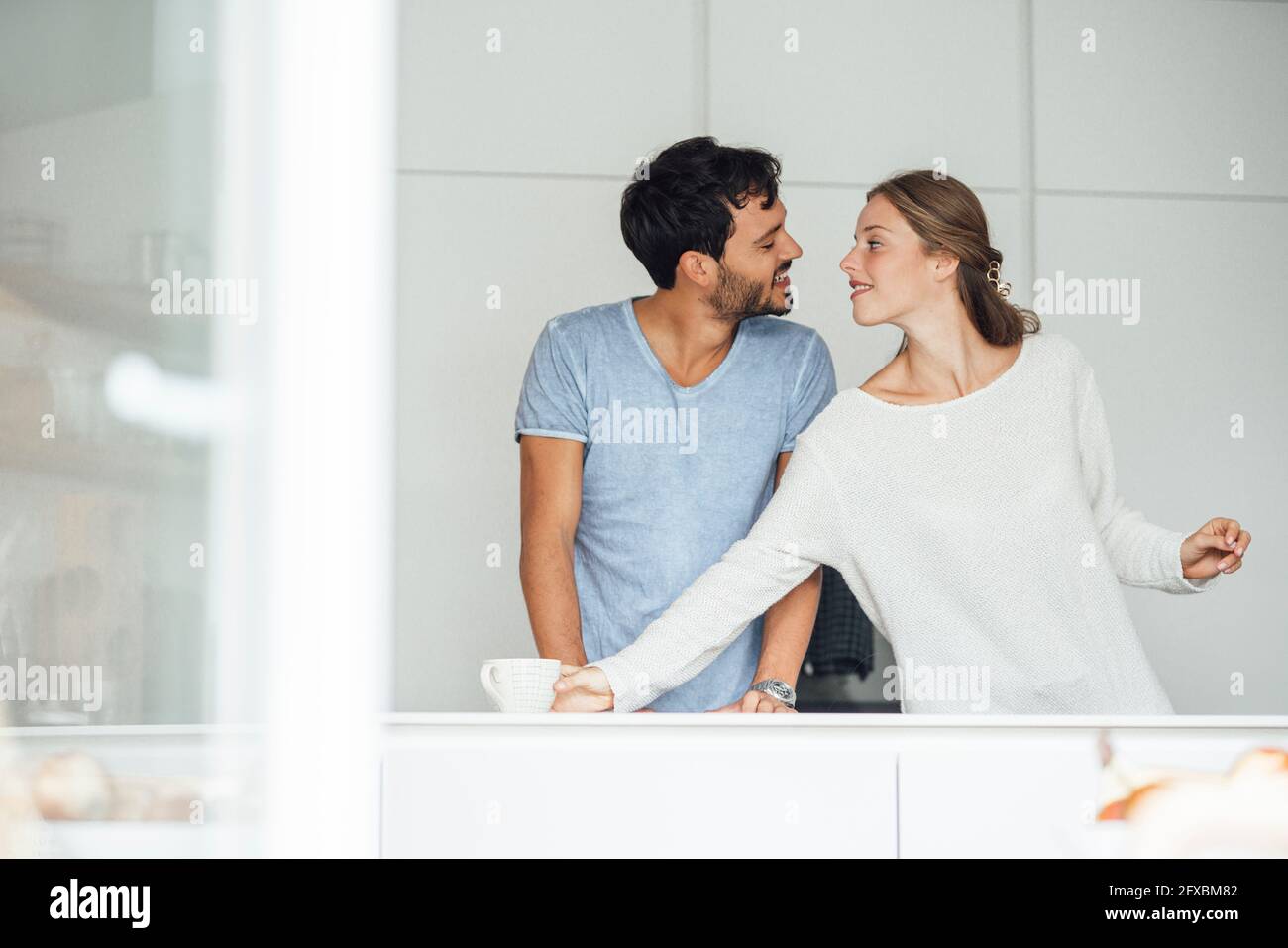 Romantic couple in kitchen hi-res stock photography and images - Alamy