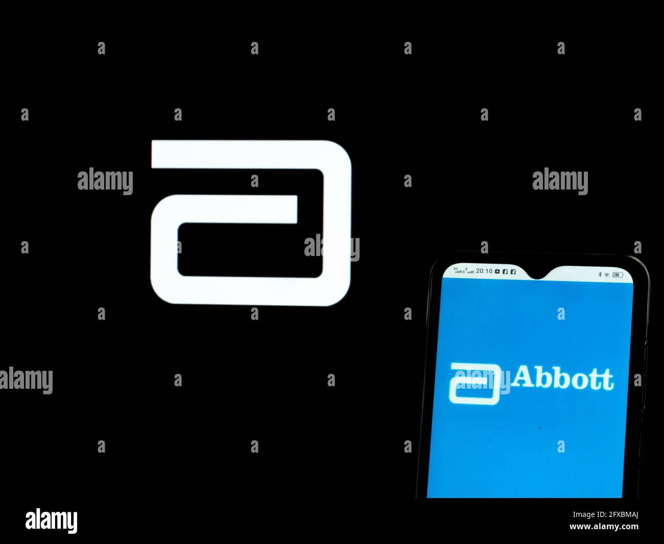 In this photo illustration, an Abbott Laboratories logo seen displayed ...