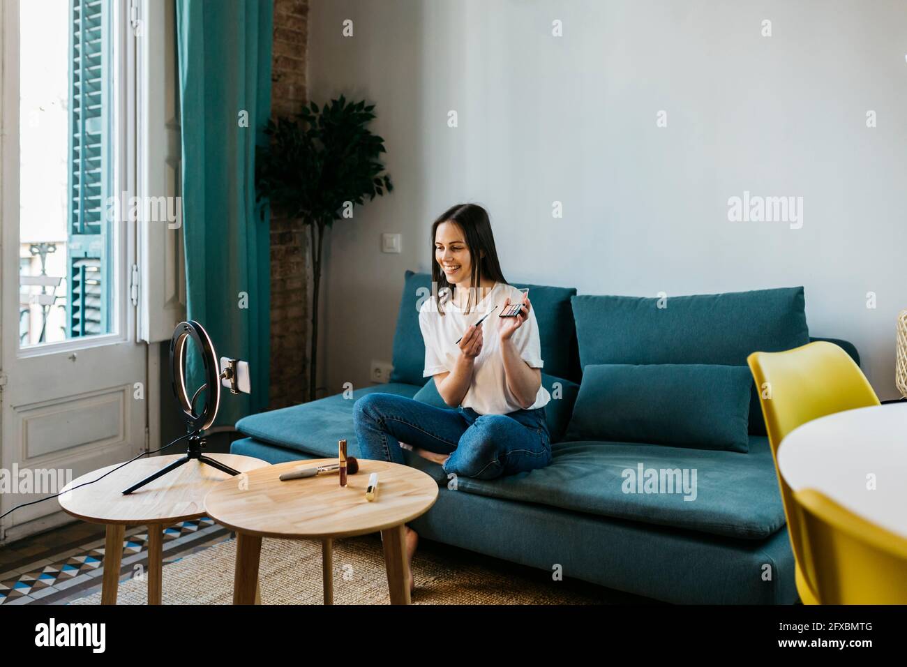 Smiling female influencer up hi-res stock photography and images - Alamy