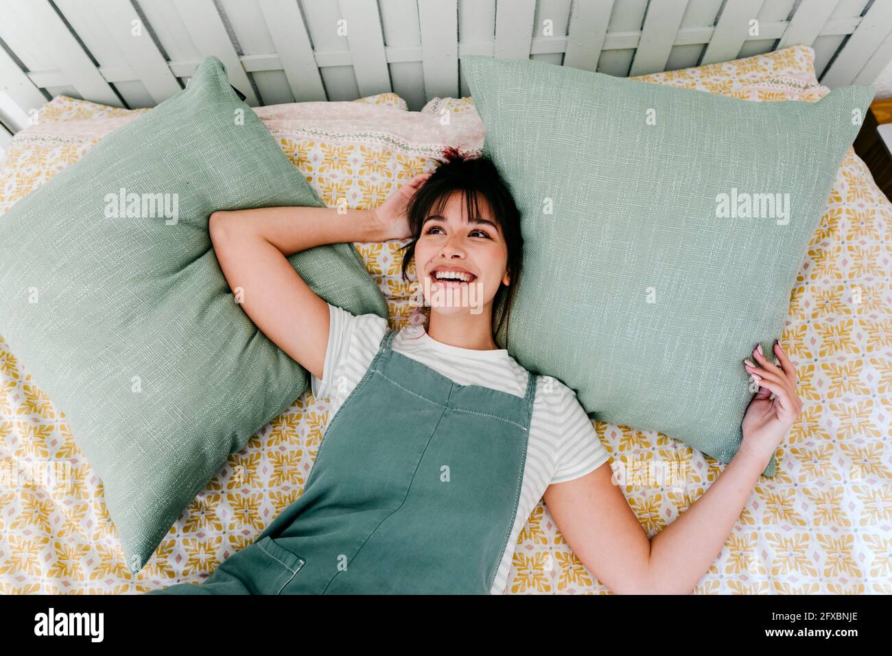 Thoughtful woman lying on back hi-res stock photography and images - Alamy