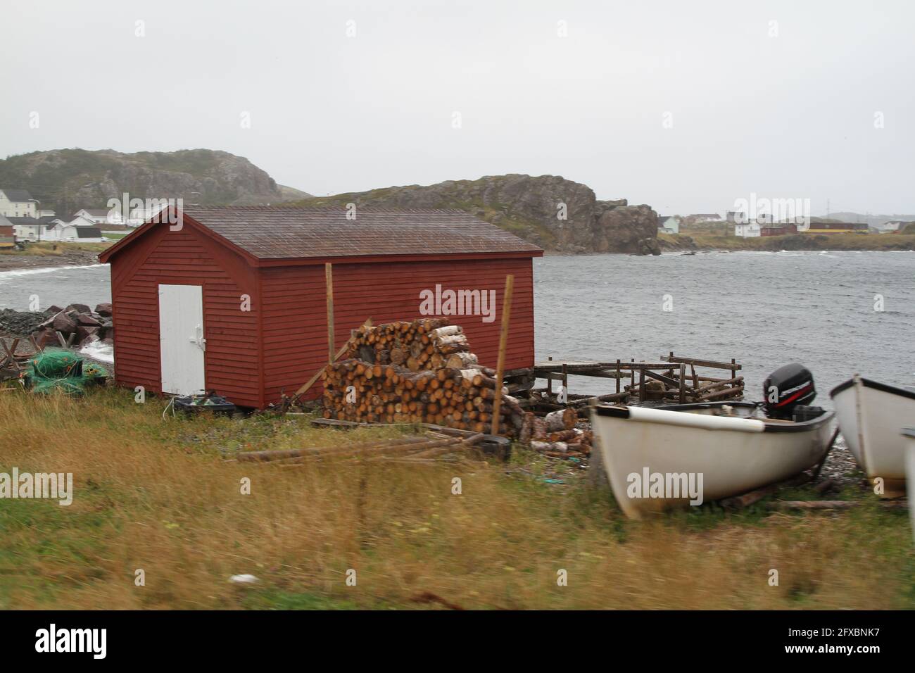 Old shed and motor boat in the harbour in Newfoundland Stock Photo - Alamy