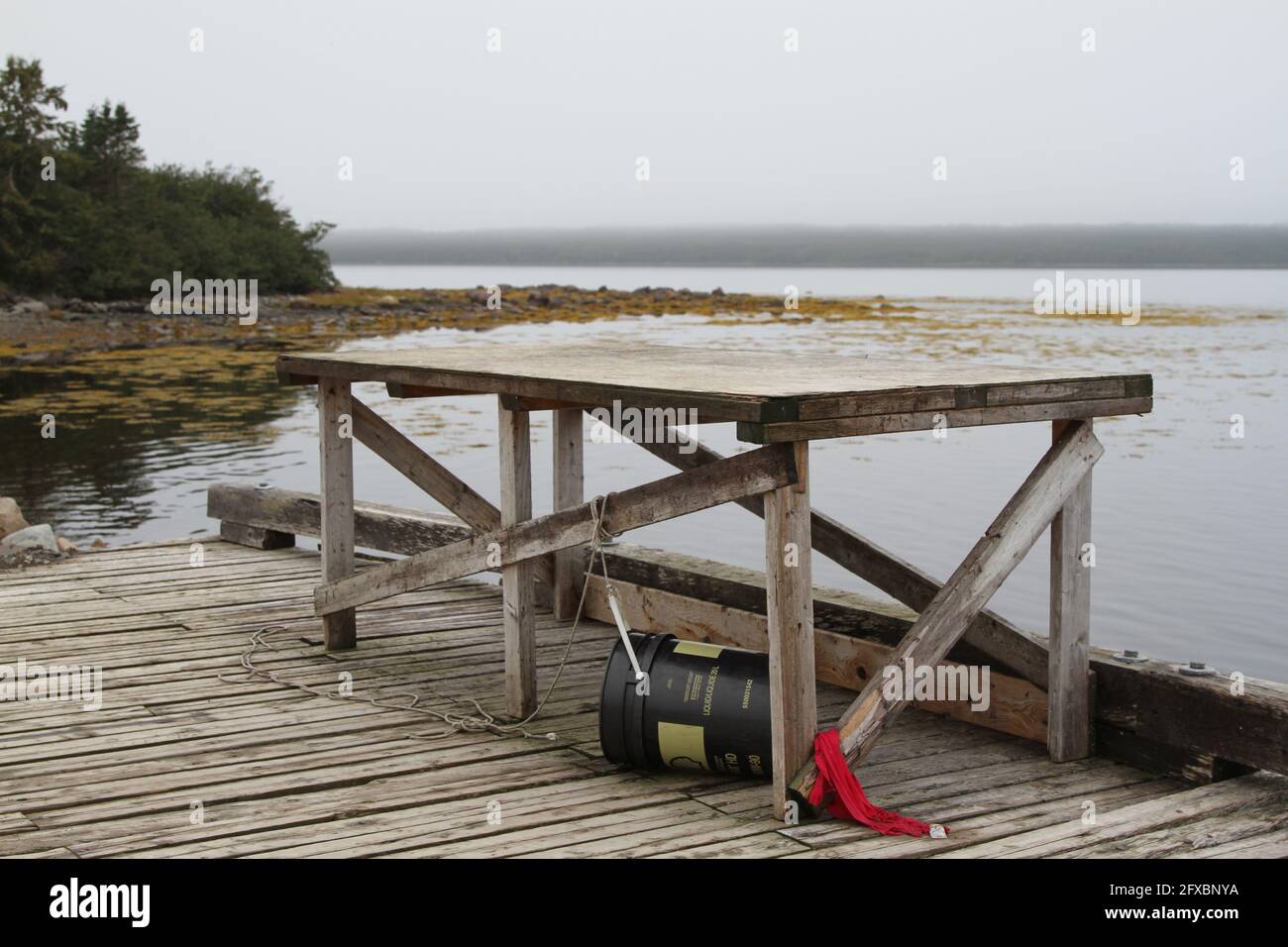 Fish gutting table in a port in Newfoundland Stock Photo - Alamy