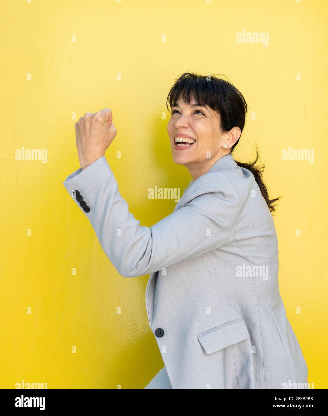 Woman cheering side view hi-res stock photography and images - Alamy