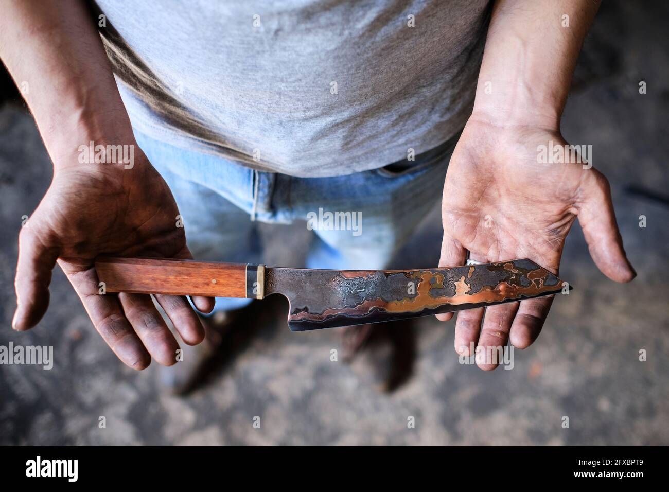 Blacksmith workshop man holding metal hi-res stock photography and ...
