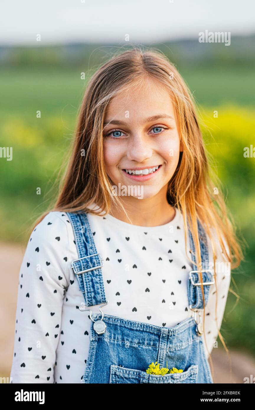 Smiling girl child standing hi-res stock photography and images - Alamy