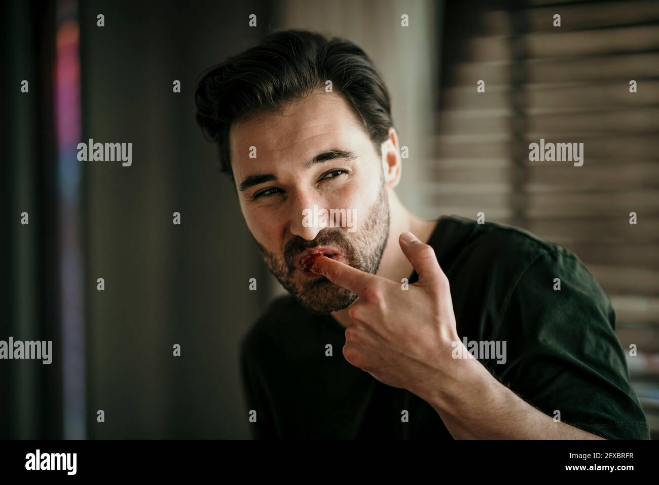 Finger licking hi-res stock photography and images - Alamy