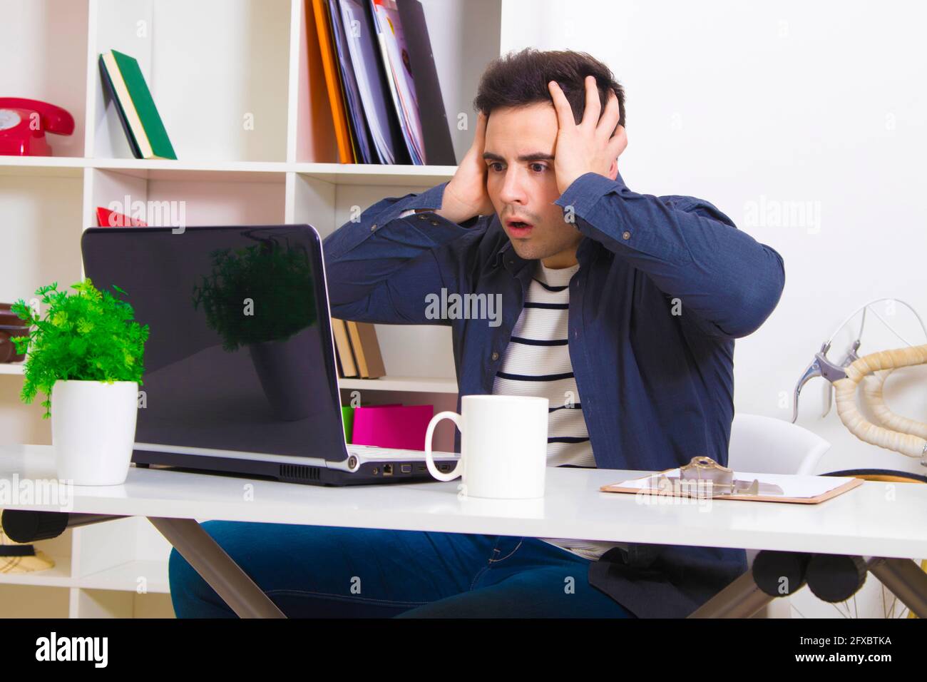 Man afraid laptop home hi-res stock photography and images - Alamy