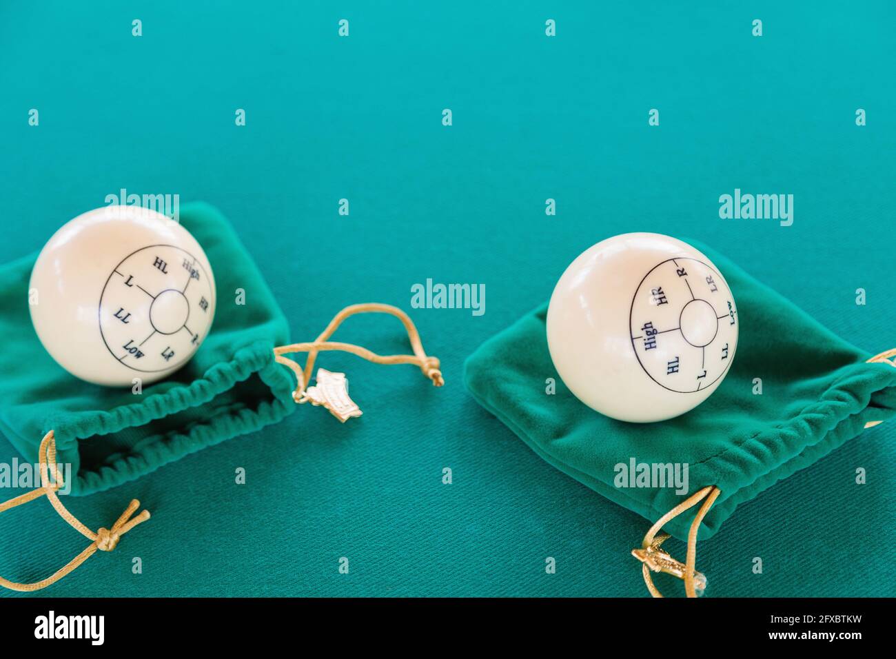 Labeled billiard balls with green packaging bags Stock Photo - Alamy