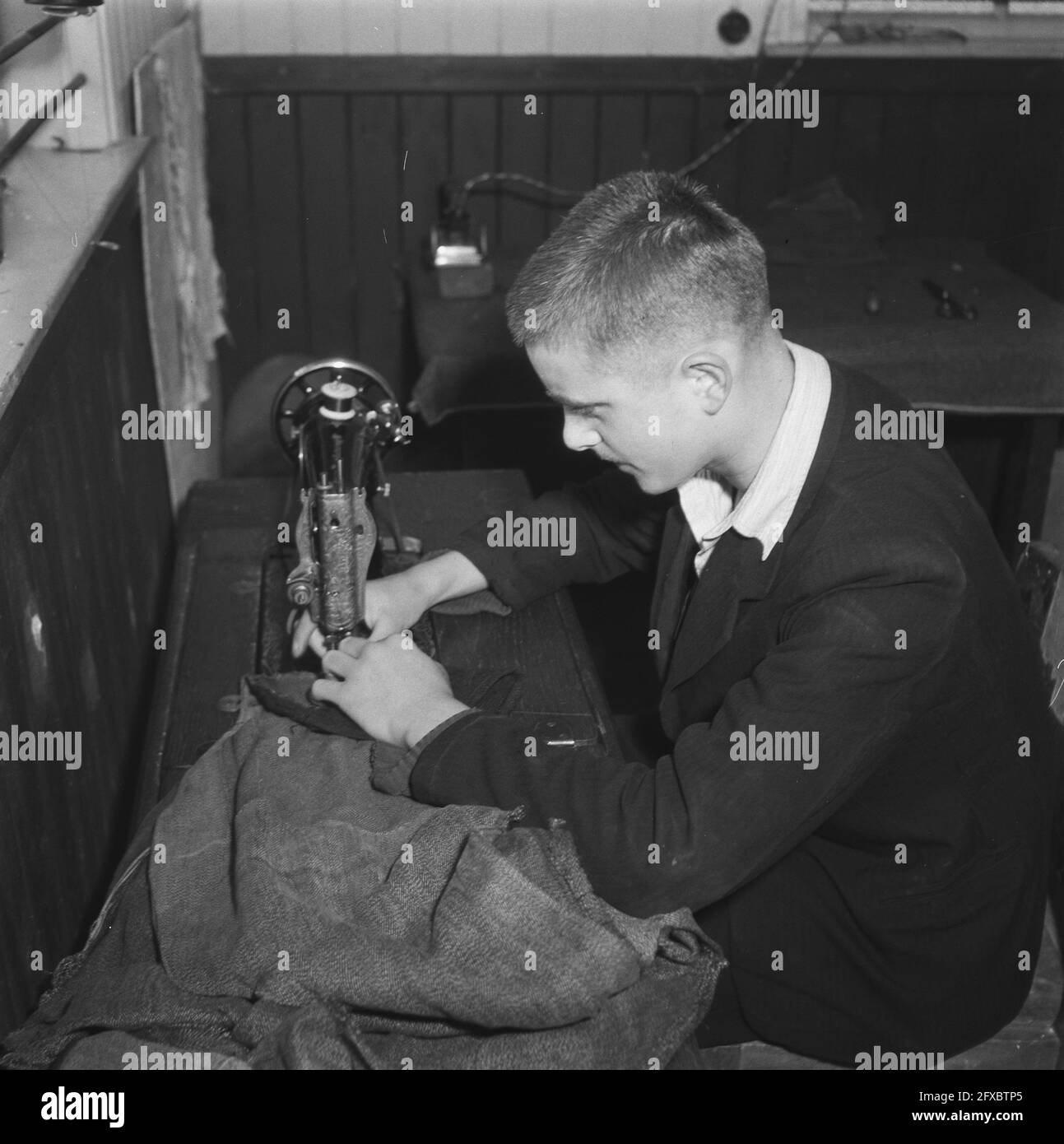 Boy behind a sewing machine, October 1945, children, education, foster ...
