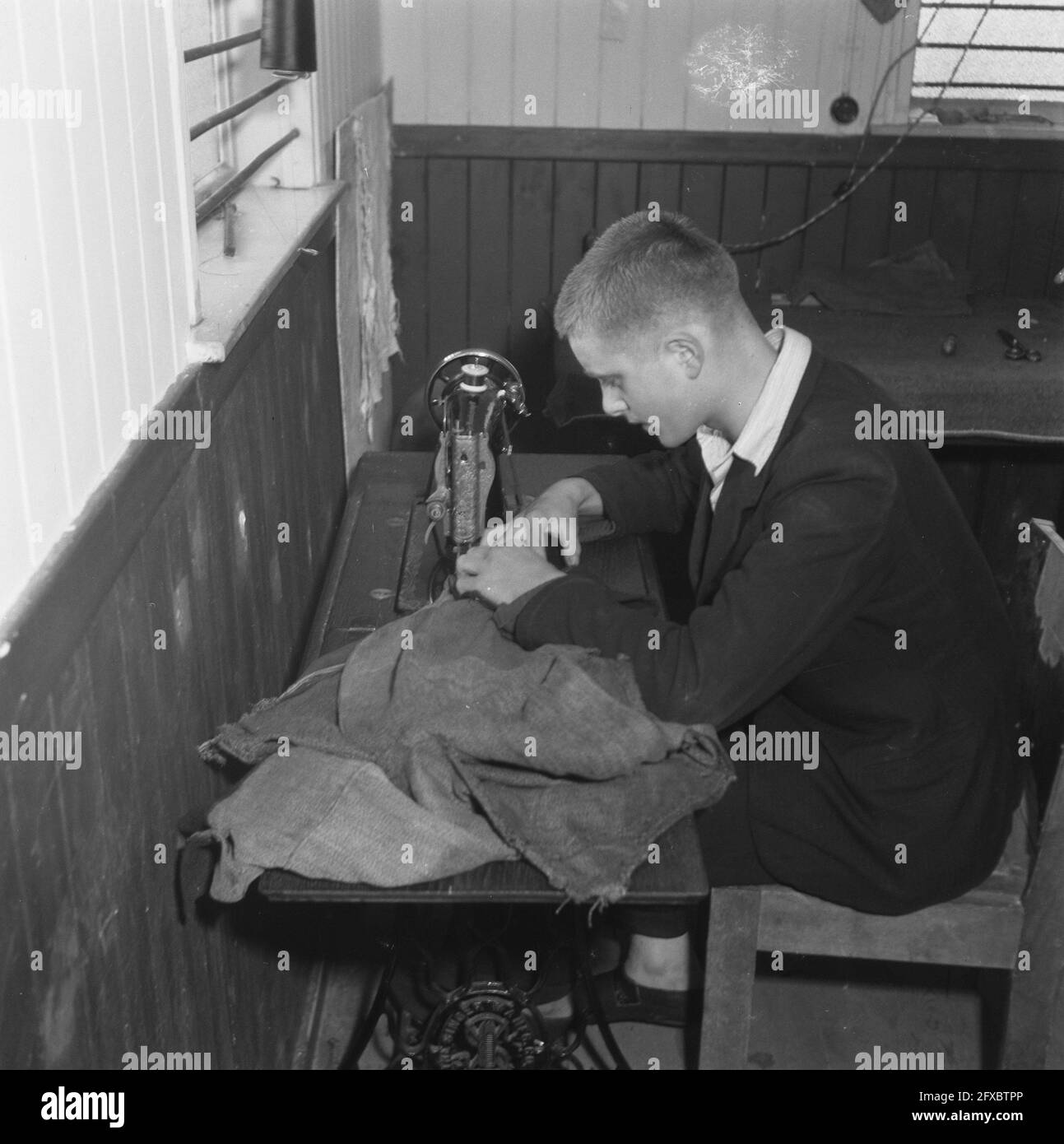 Boy behind a sewing machine, October 1945, children, education, foster ...