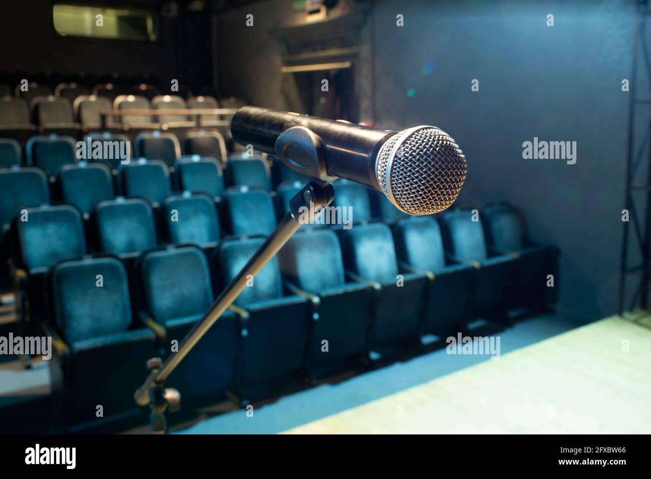 Microphone standing in empty theater Stock Photo - Alamy
