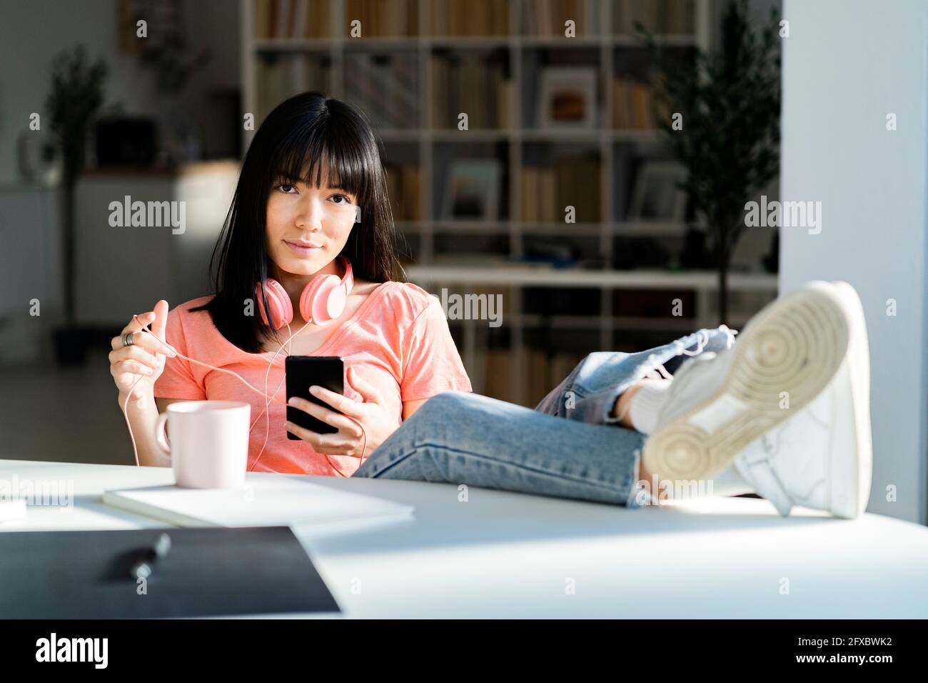 Woman with feet up hi-res stock photography and images - Alamy