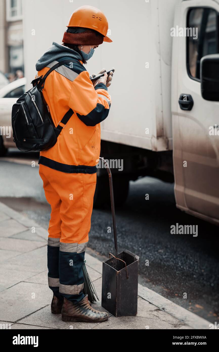 Cleaner sweeping uniform urban hi-res stock photography and images - Alamy