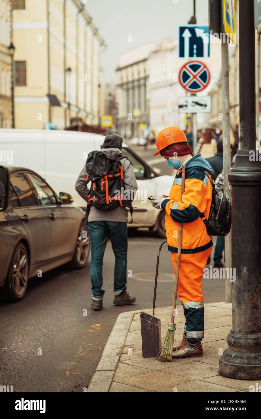 Cleaner sweeping uniform urban hi-res stock photography and images - Alamy