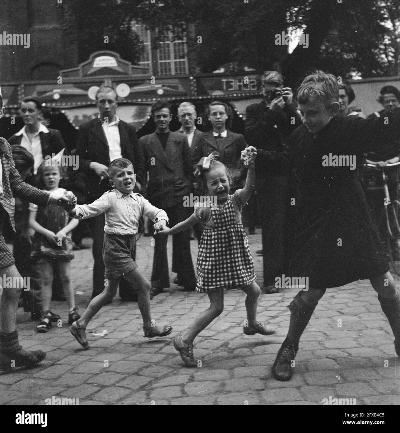 [Children dance in a circle; a girl cries], June 28, 1945, Liberation ...