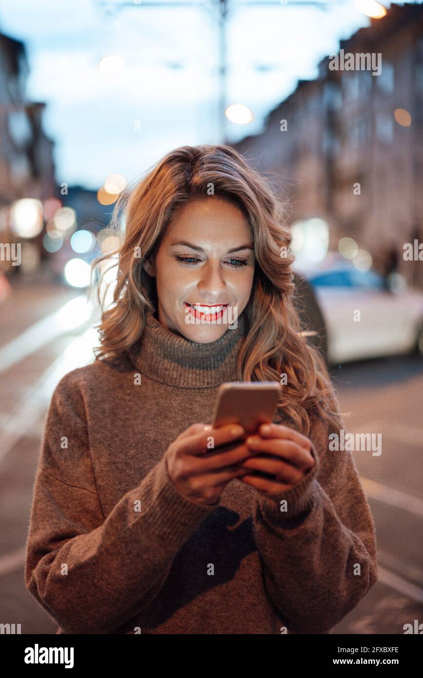 Positive woman texting online using hi-res stock photography and images ...