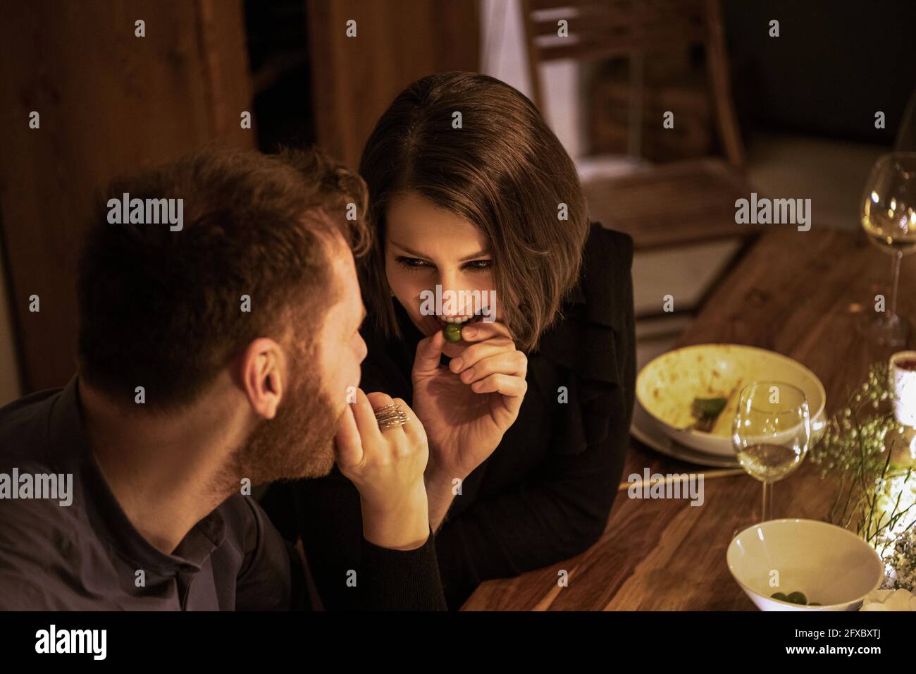 Mature couple feeding each other hi-res stock photography and images ...