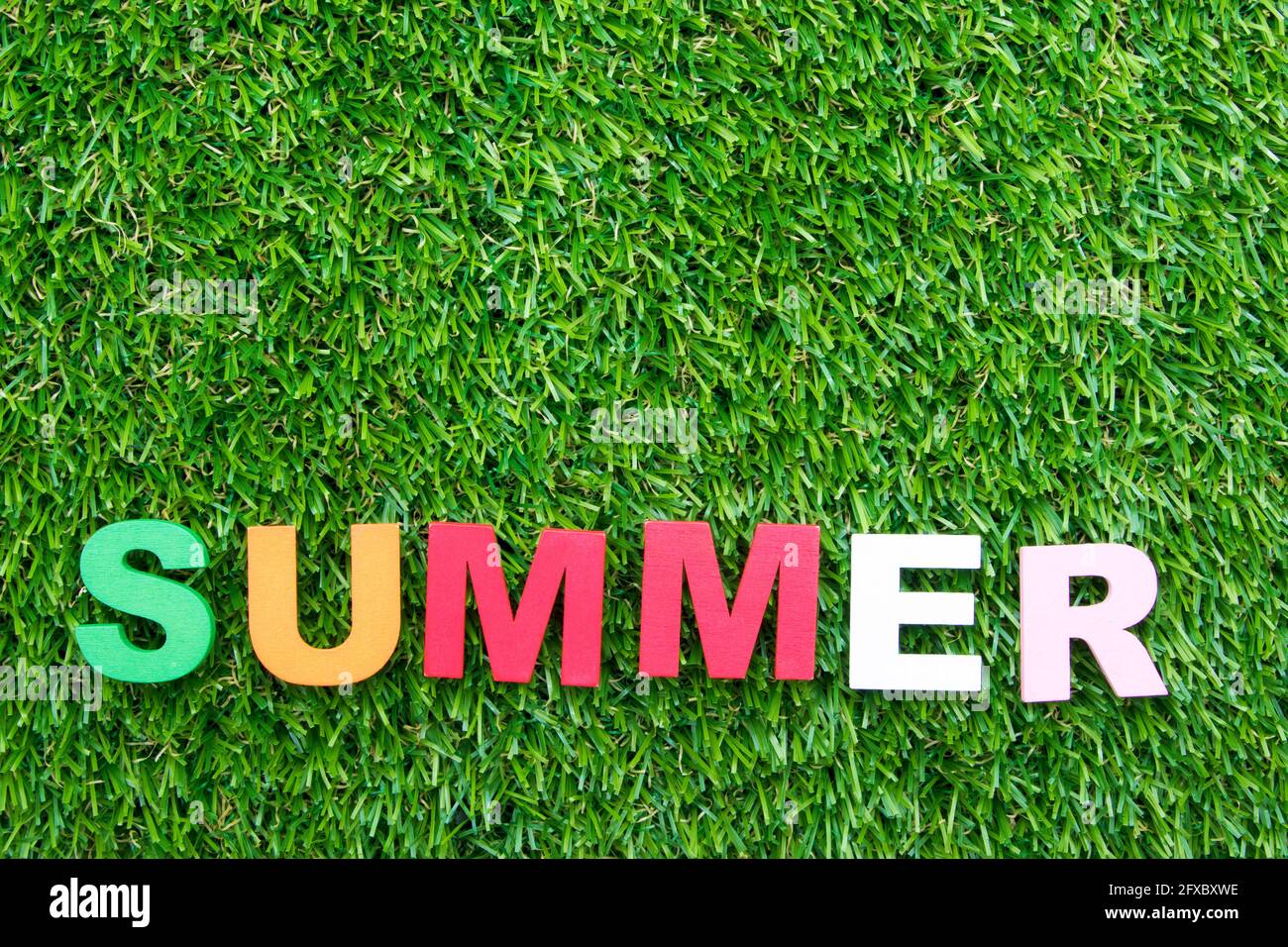 summer background with letters on green grass Stock Photo - Alamy