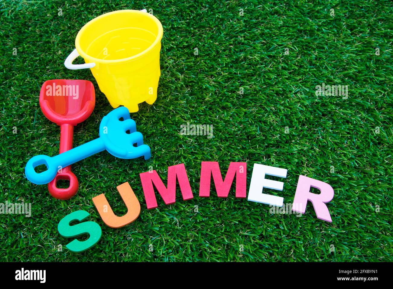 summer background with letters on green grass Stock Photo - Alamy