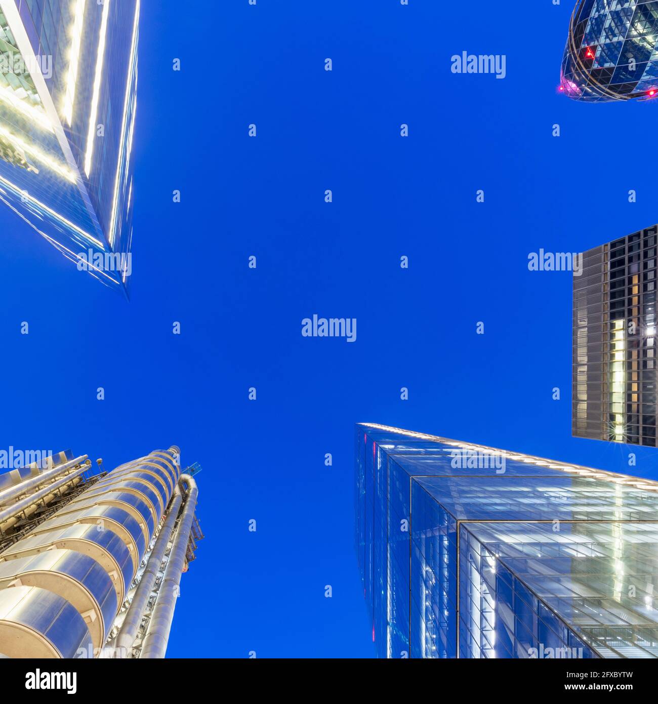 UK, England, London, Blue sky over tall skyscrapers at dusk Stock Photo ...