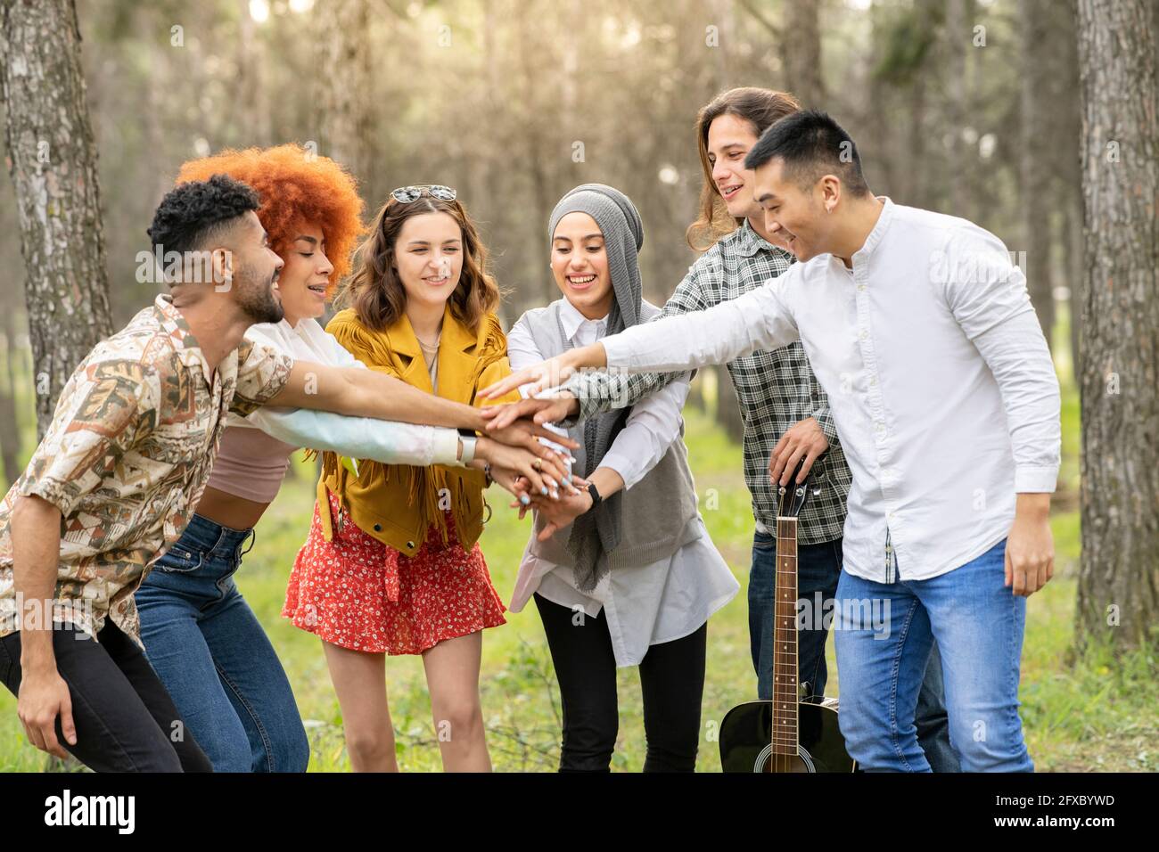 Stacking hands multiethnic hi-res stock photography and images - Alamy