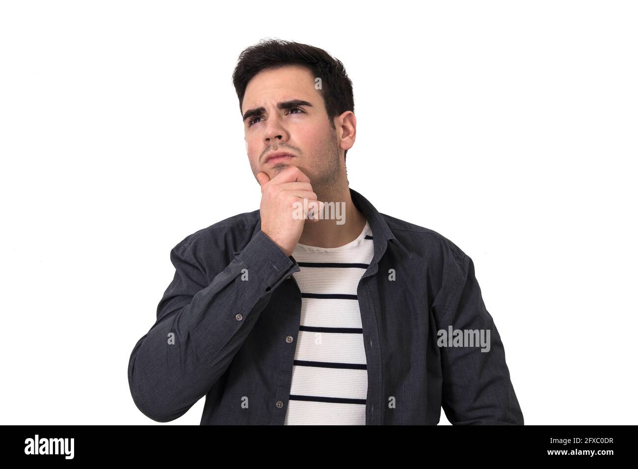 thoughtful young man isolated on white background Stock Photo - Alamy