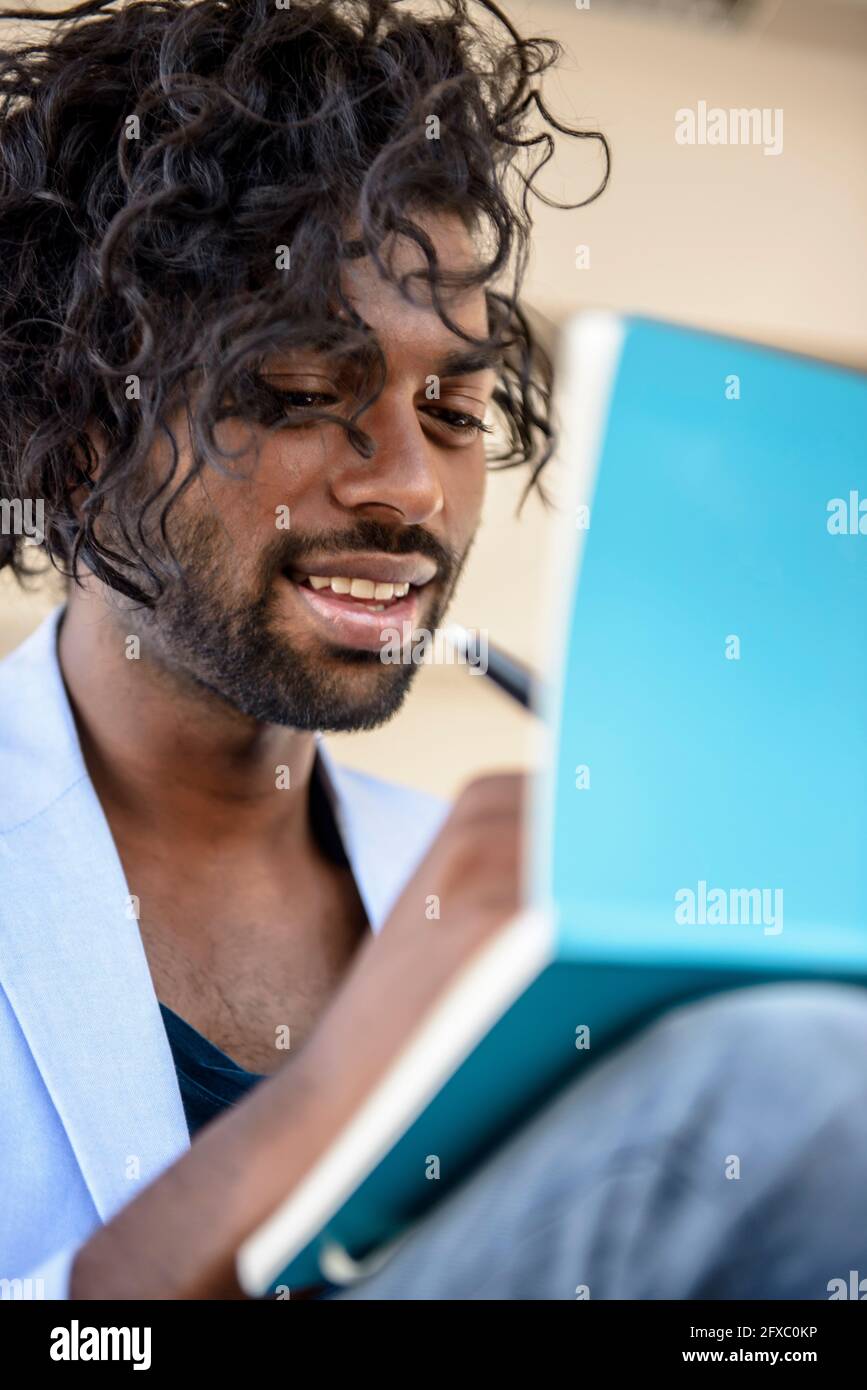 Man writing in book hi-res stock photography and images - Alamy