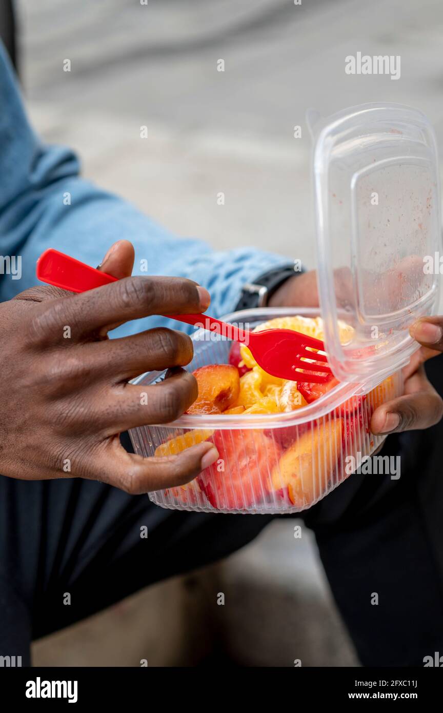 Young man holding lunch hi-res stock photography and images - Alamy