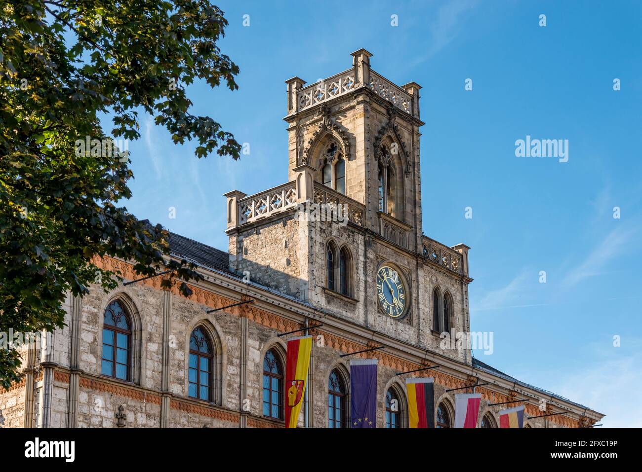 Germany, Thuringia, Weimar, Town hall with clock, carillon and flags ...