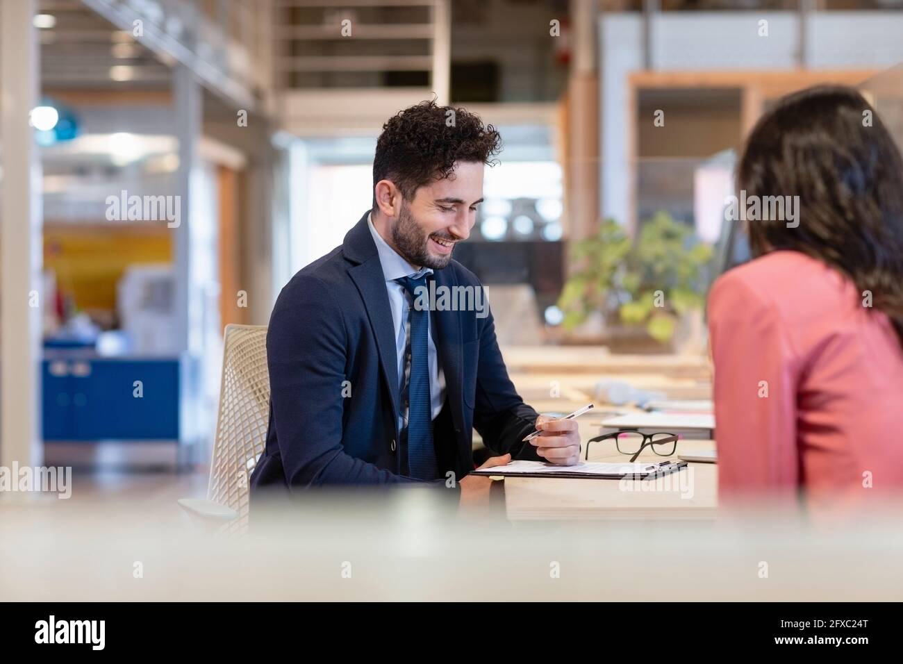 Businessman in office signing hi-res stock photography and images - Alamy