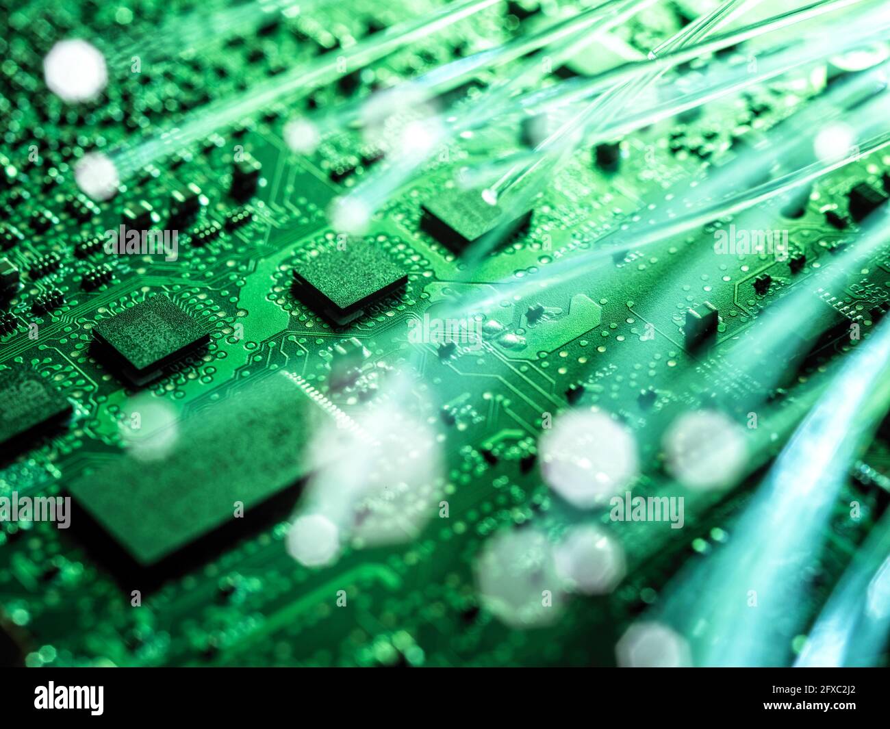 Fibre optics carrying data being transferred to desktop computer Stock ...