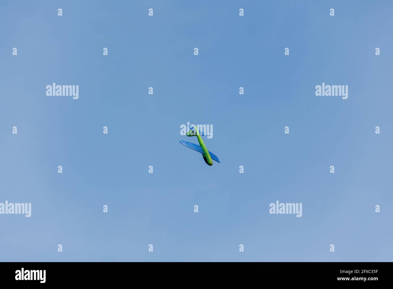 small plane performs a trick in the sky Stock Photo - Alamy