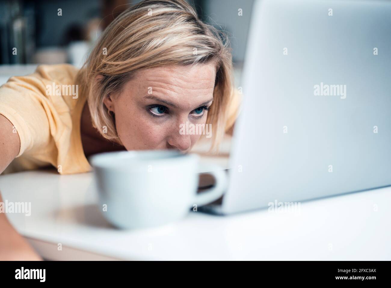 Tired woman looking computer hi-res stock photography and images - Alamy