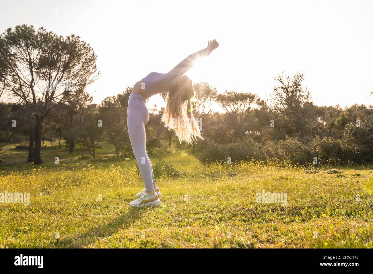 Young woman bending over backwards hi-res stock photography and images ...