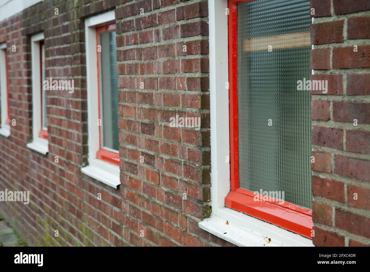 Row windows and wall Stock Photo - Alamy
