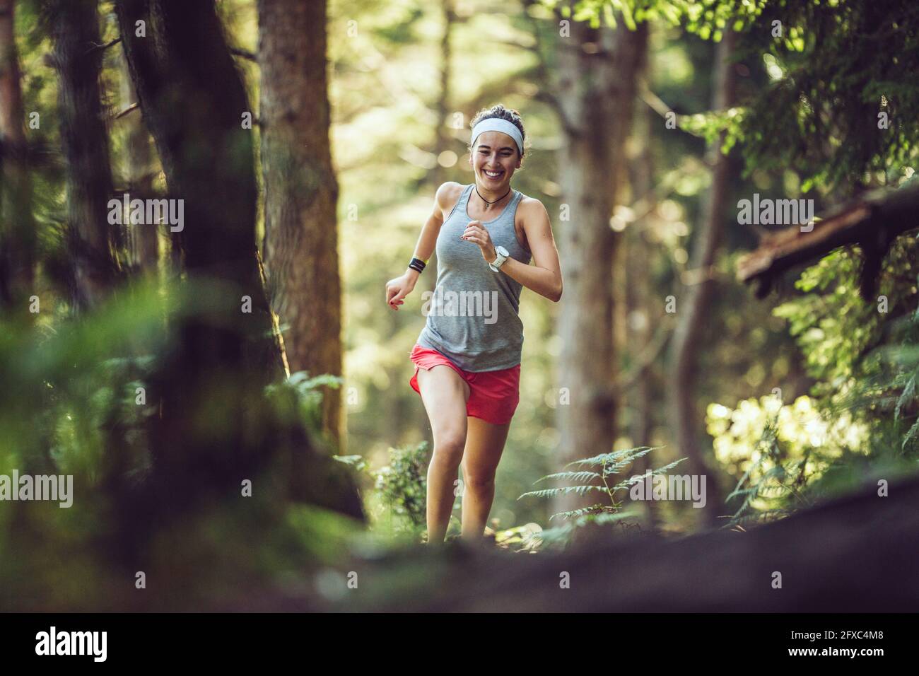 Fitness woman running forest trail hi-res stock photography and images ...