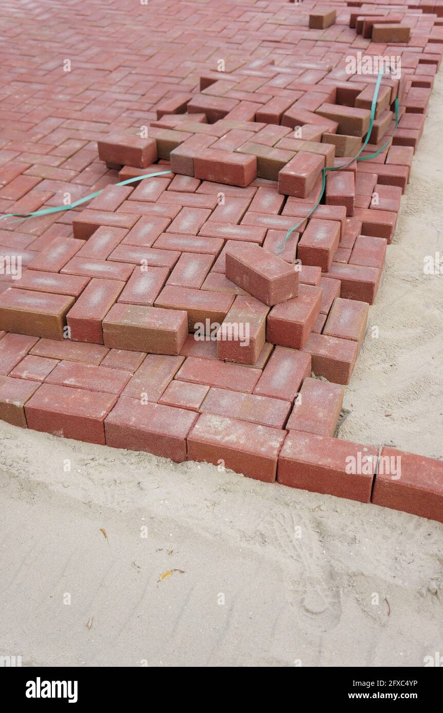 Street bricks and sand Stock Photo - Alamy