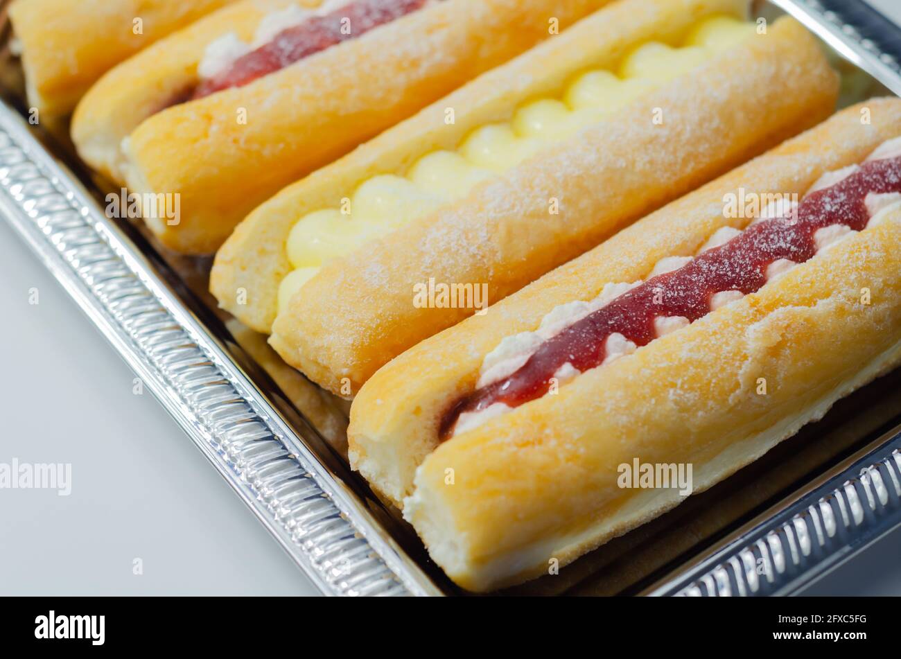 Mixed finger donuts filling chocolate, custard, jam and whipped cream ...
