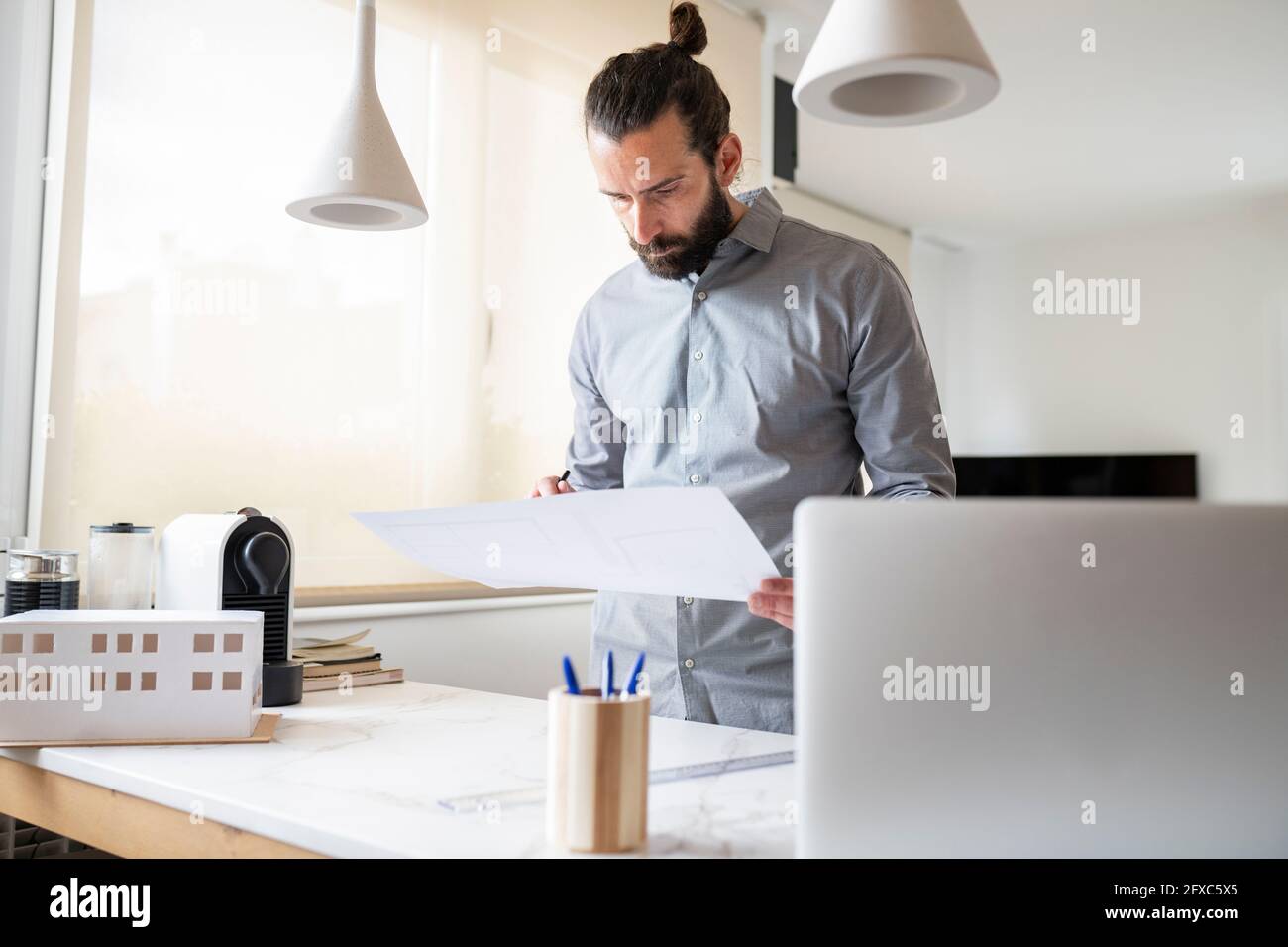 Handsome male architect working hi-res stock photography and images - Alamy