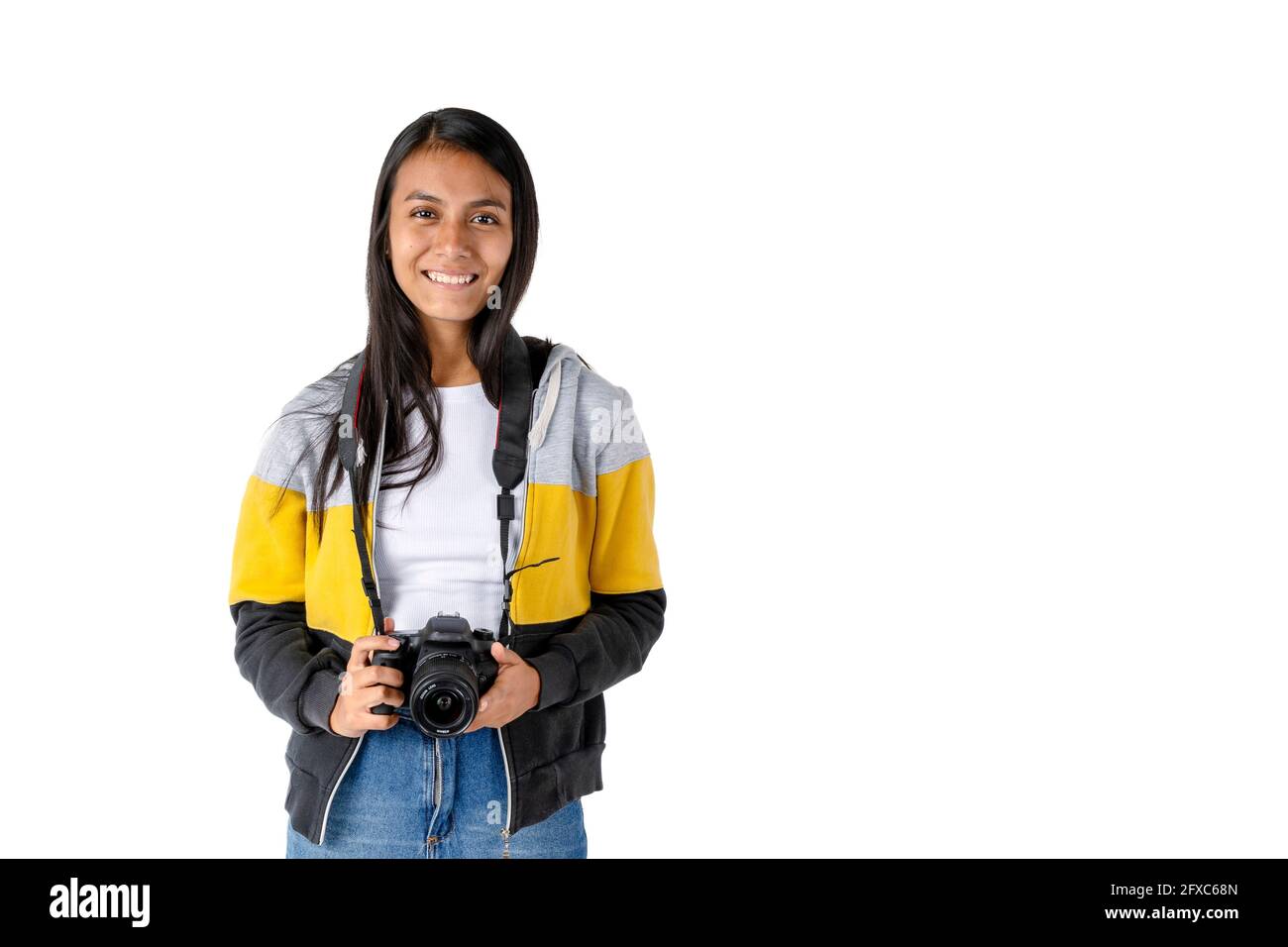 Young female photographer posing smiling with her camera in her hand ...