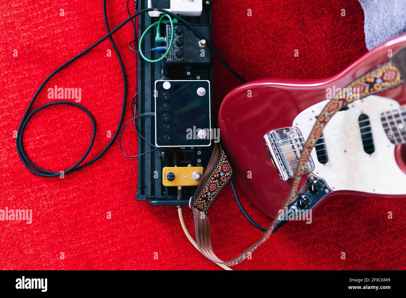 Musical instrument and guitar on carpet in studio Stock Photo - Alamy