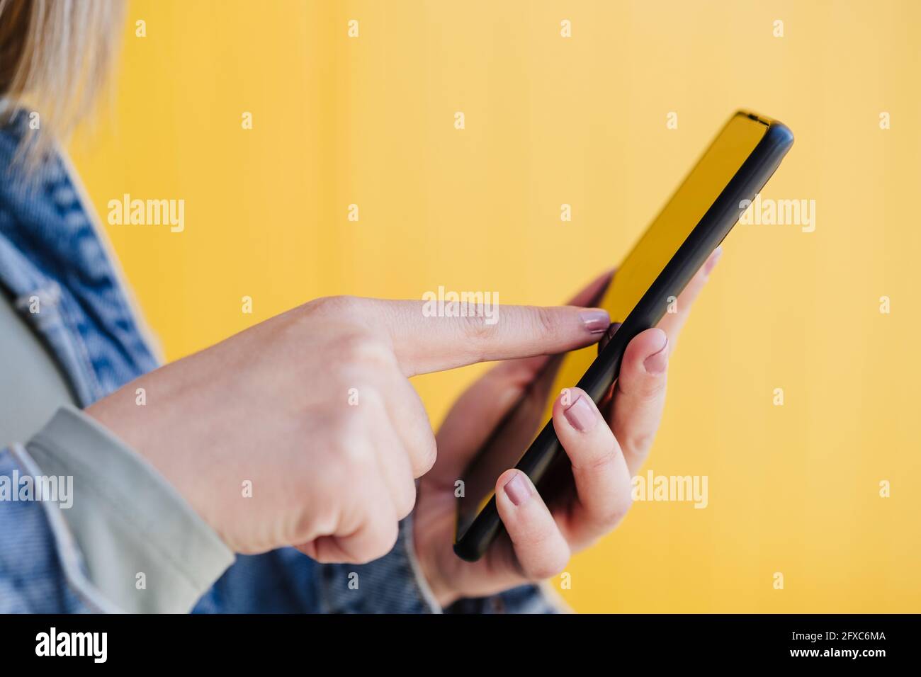 Woman using touchscreen phone outdoors hi-res stock photography and ...