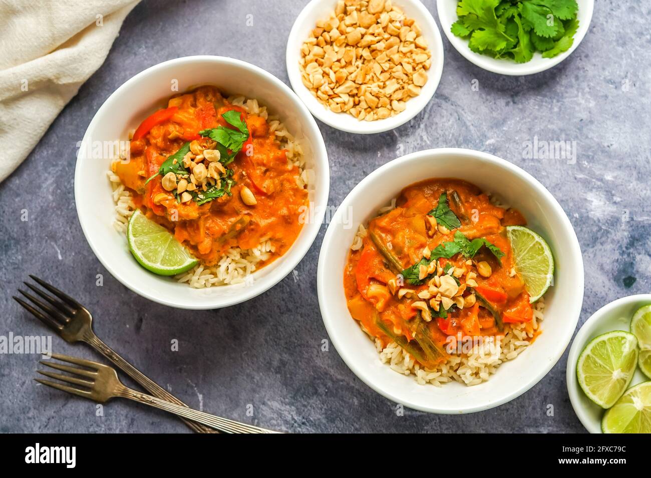 Thai peanut curry over brown rice Stock Photo - Alamy
