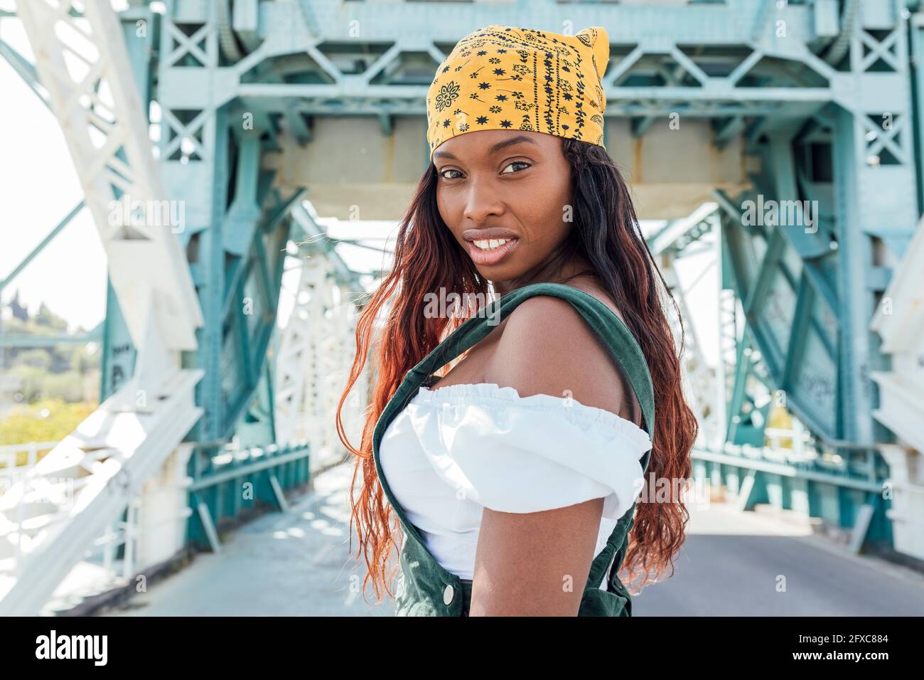 Woman in bandana at bridge Stock Photo - Alamy