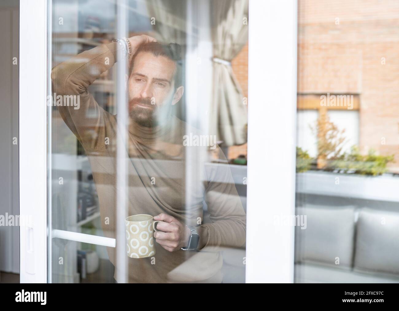 Leaning man holding glass hi-res stock photography and images - Alamy