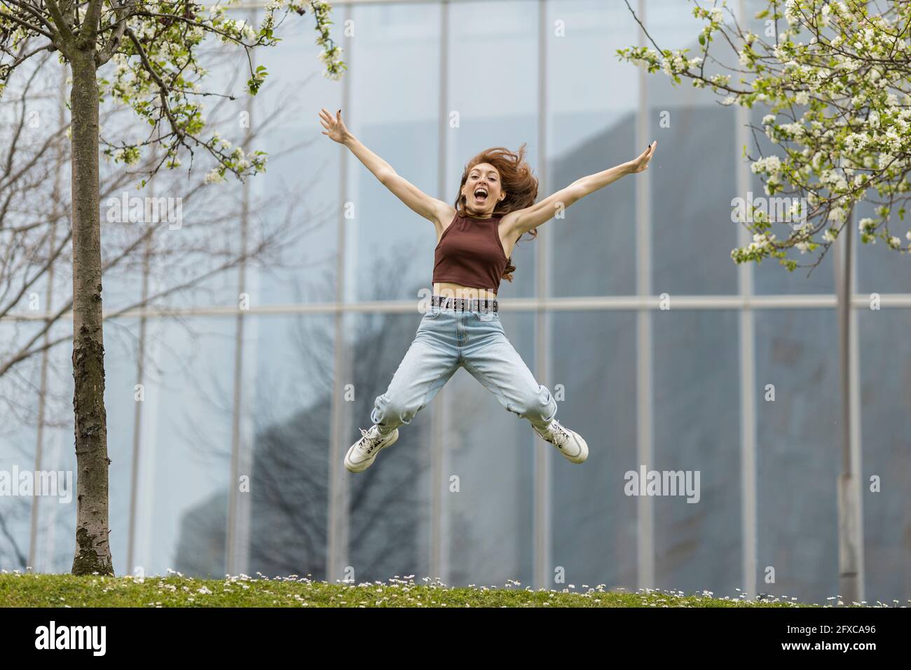 Beautiful young woman jumping over hi-res stock photography and images ...