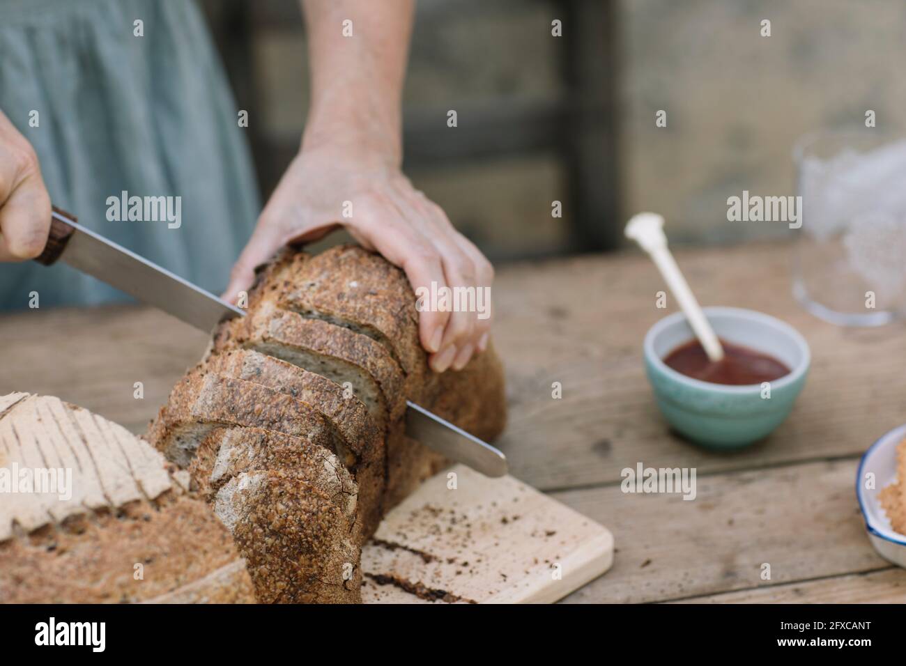 Person cutting wood on table hi-res stock photography and images - Alamy