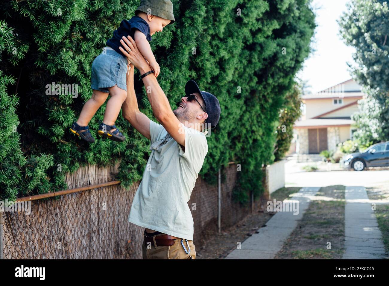 Father picking up baby hi-res stock photography and images - Alamy